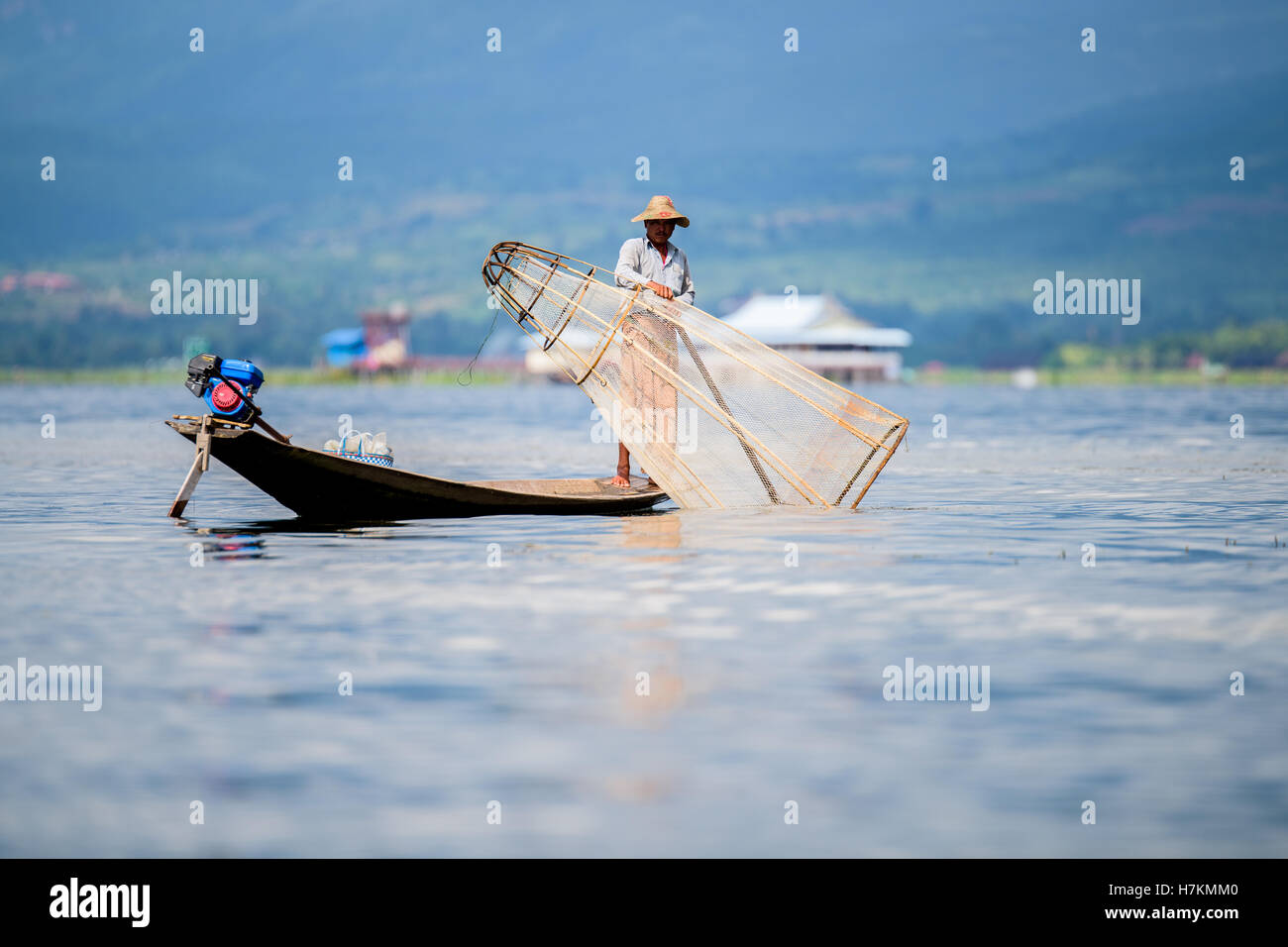 Inle Lake fisherman on a boat Stock Photo - Alamy