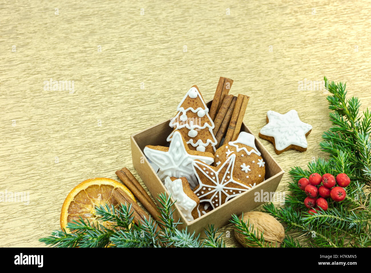 gingerbread cookies in christmas gift box, fruits, nuts and fir tree ...