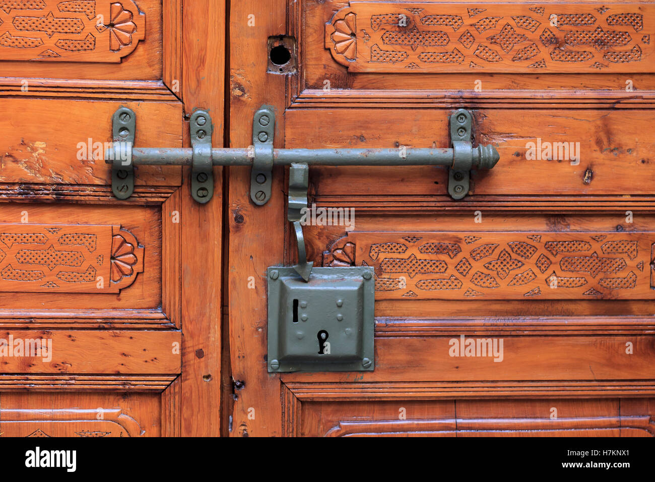 Part of old rustic door with metal lock and handle Stock Photo - Alamy