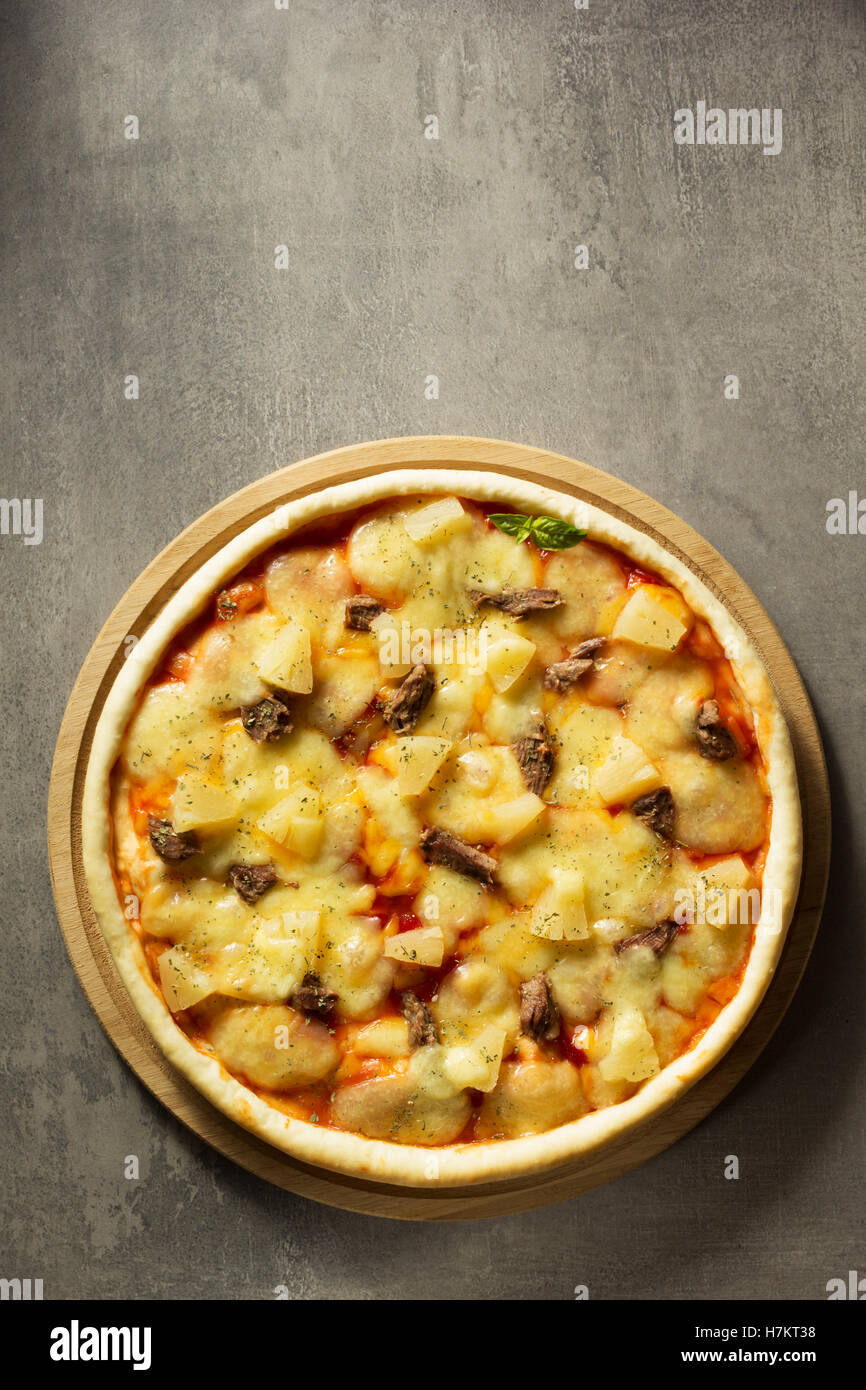 italian pizza at table background Stock Photo - Alamy