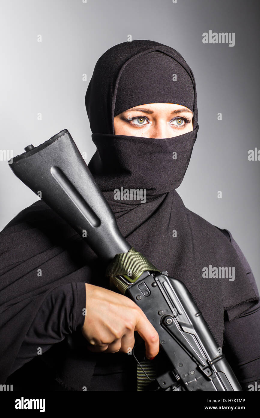 Close-up of muslim woman with a gun Stock Photo - Alamy