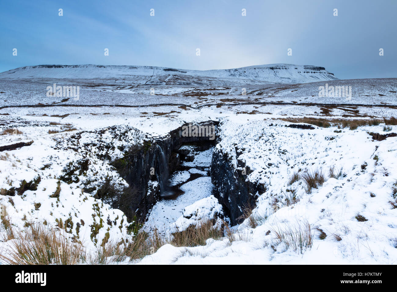 Snow covered scene of Hull Pot with Pen-y-ghent in the Yorkshire Dales ...