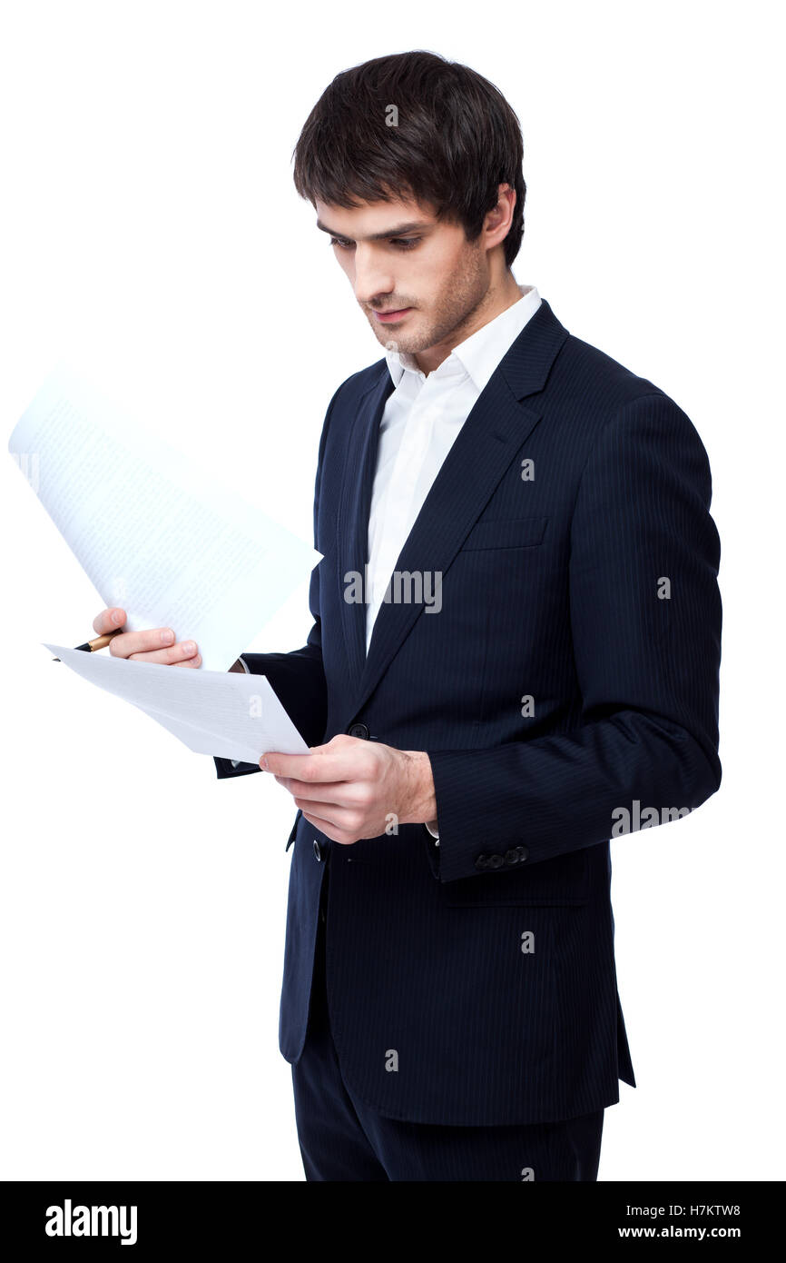 Professional businessperson reading document hi-res stock photography ...