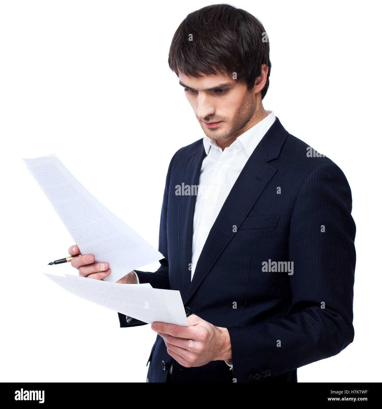 Professional businessperson reading document hi-res stock photography ...