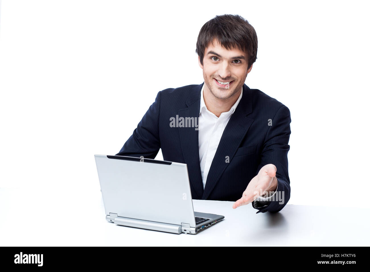 Laptop sitting on table Cut Out Stock Images & Pictures - Alamy