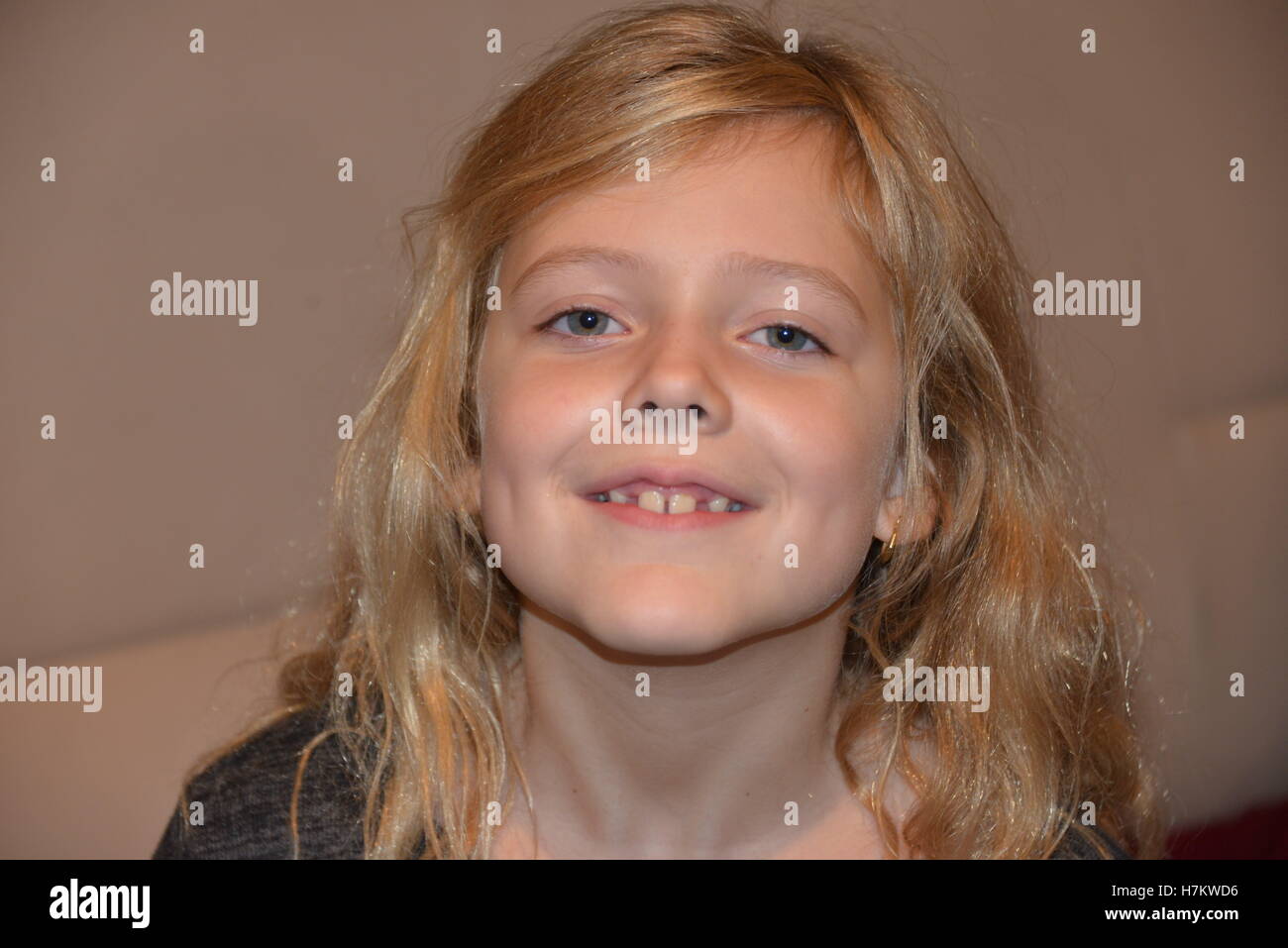 head shots of young girl aged 8 years smiling Stock Photo - Alamy