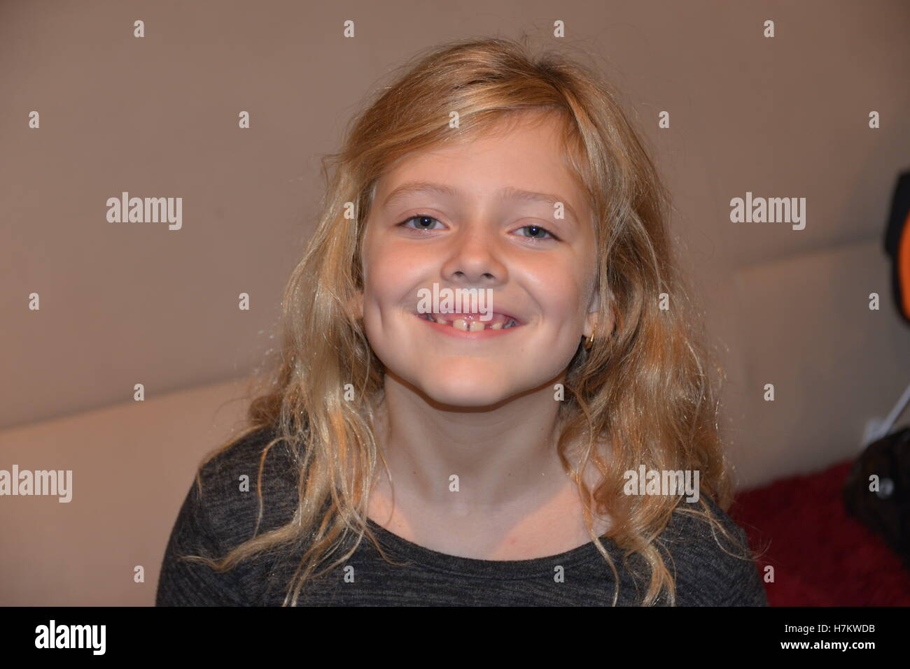 head shots of young girl aged 8 years smiling Stock Photo - Alamy