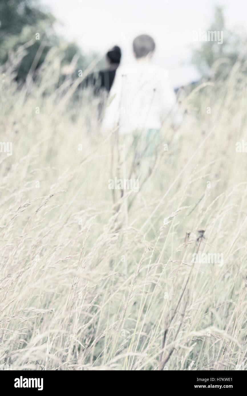Child walking in meadow. Lifestyle image of childhood summer adventure ...