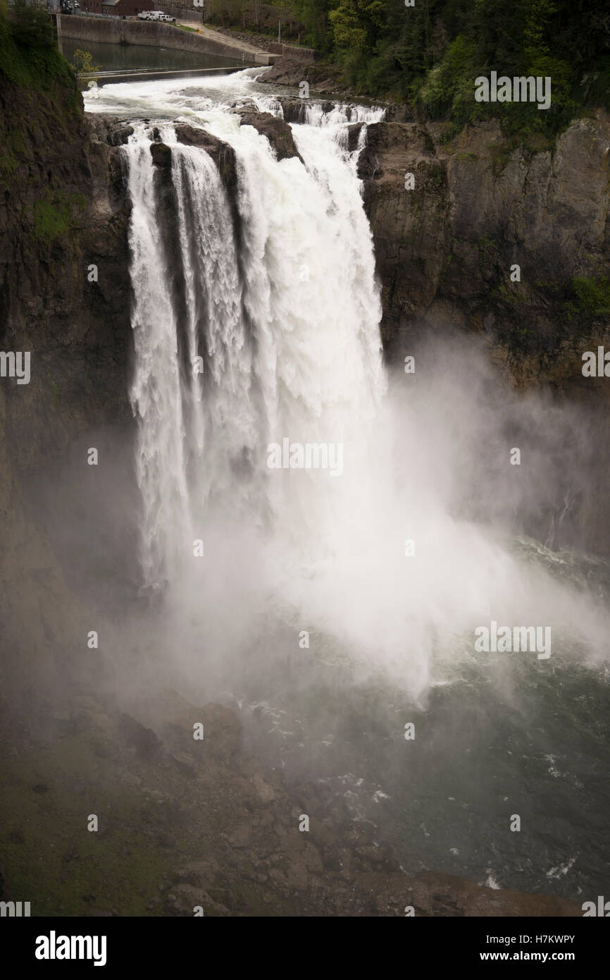 A large flow of water travels over the ridge creating a waterfall Stock ...