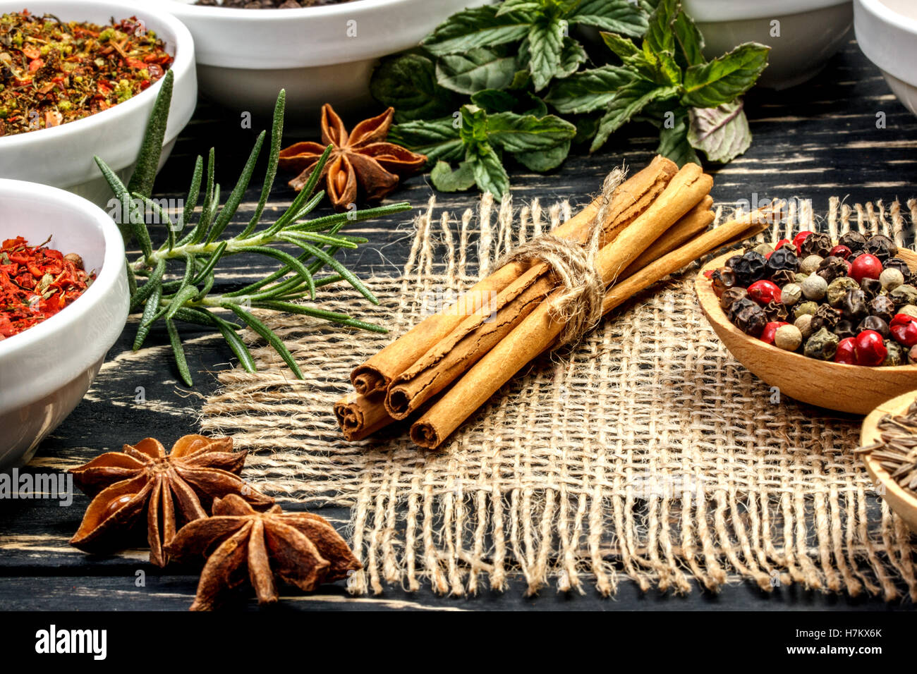 Colorful aromatic Indian spices and herbs on an old oak wooden brown ...
