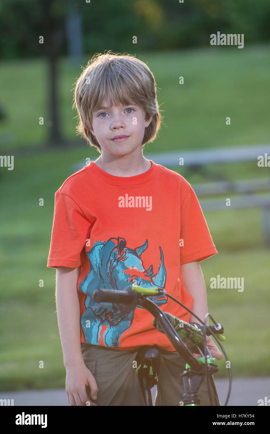 Portrait of a blonde boy with blurred background Stock Photo - Alamy
