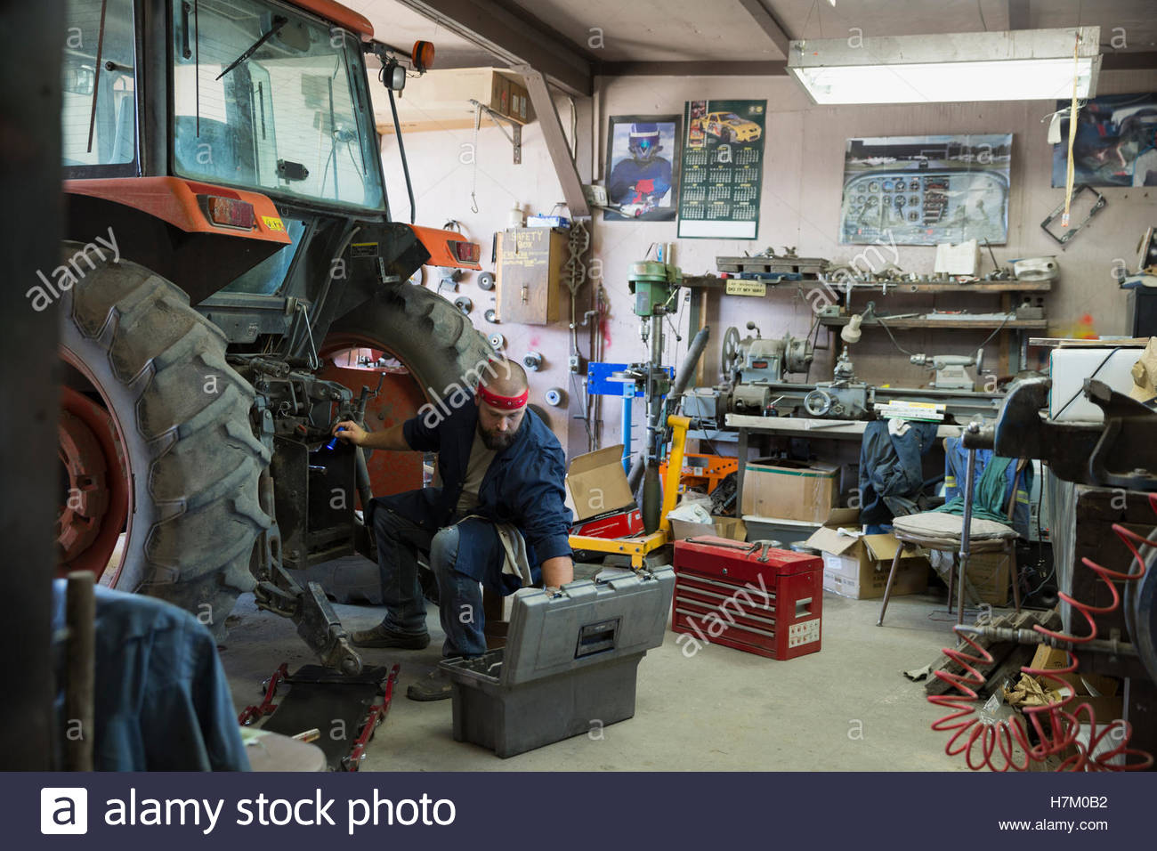Working on tractor hi-res stock photography and images - Alamy