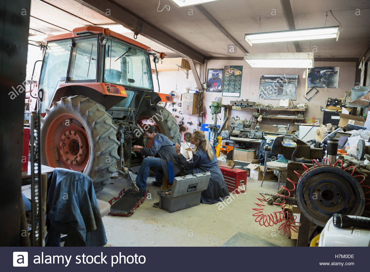 Mechanics repairing tractor hi-res stock photography and images - Alamy