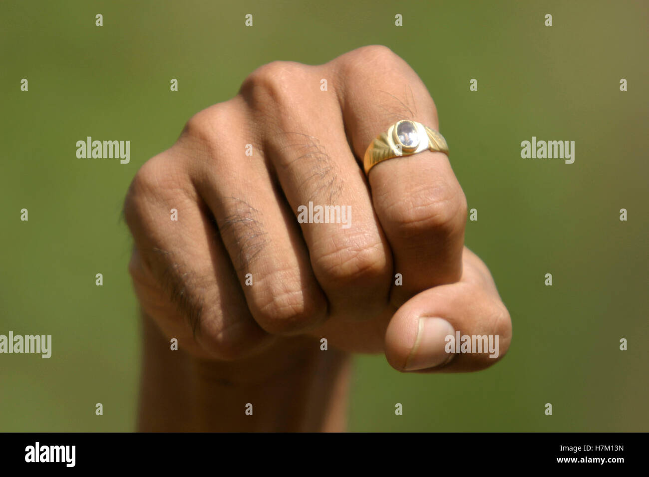 Hand-punch with a ring Stock Photo - Alamy