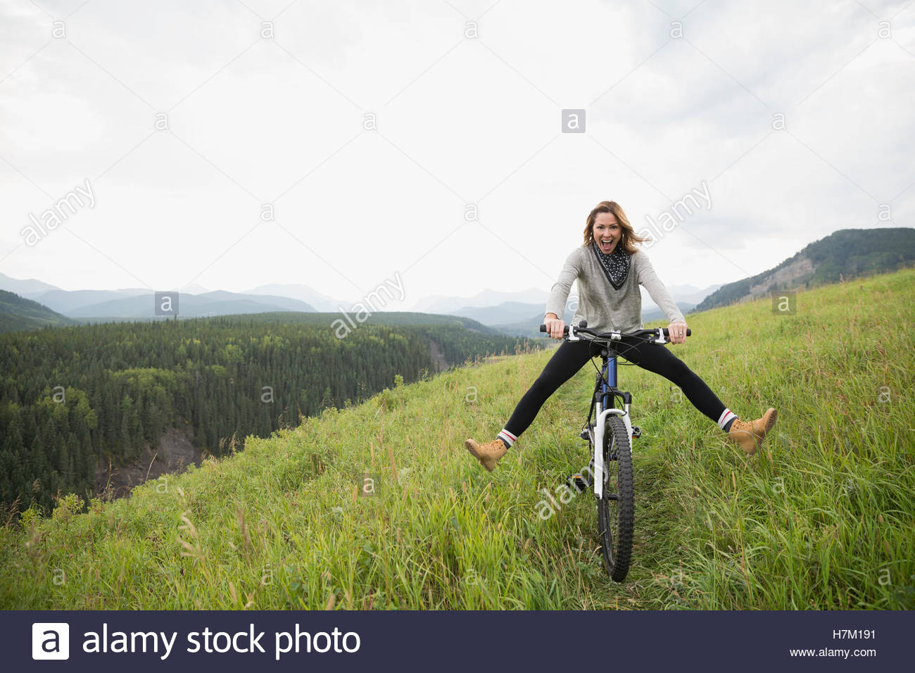Person riding bike hi-res stock photography and images - Alamy
