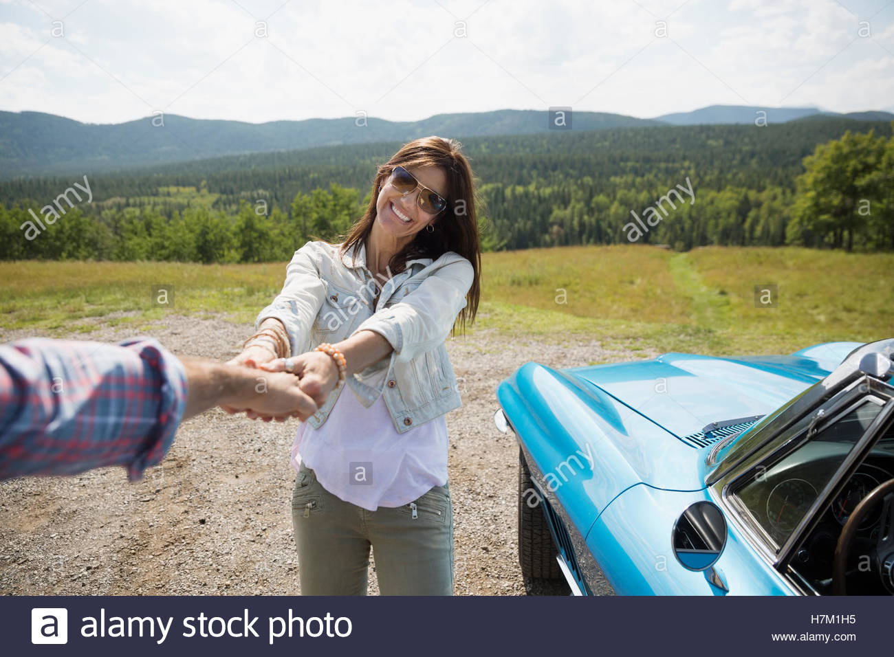 Woman leading man by hand hi-res stock photography and images - Alamy
