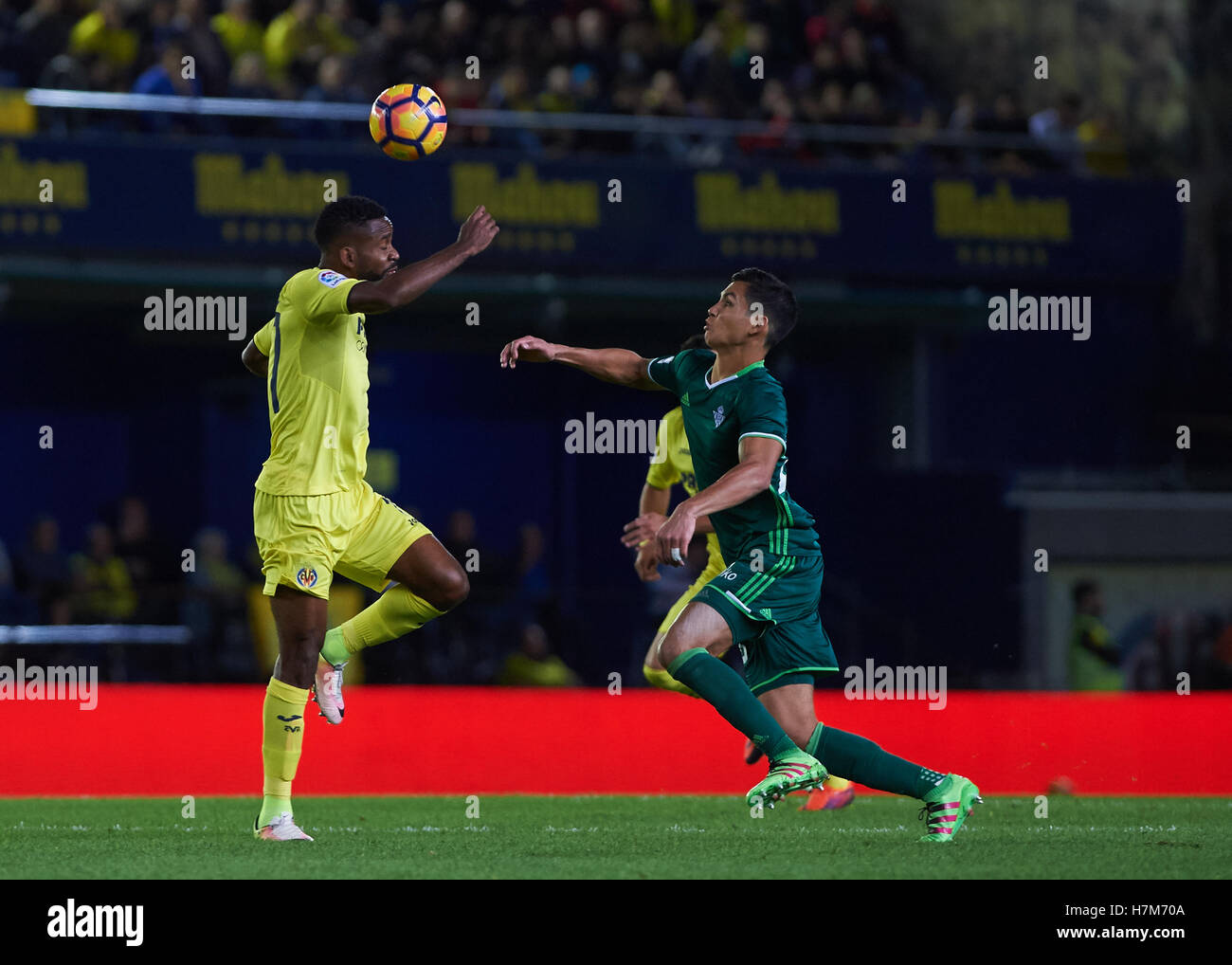 Cedric Bakambu of Villarreal CF and Felipe Gutierrez of Real Betis ...