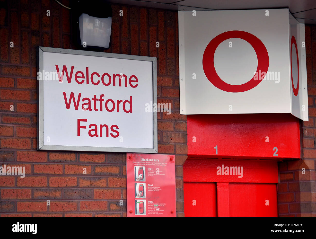 Away turnstile with a sign welcoming Watford fans to the ground ahead ...