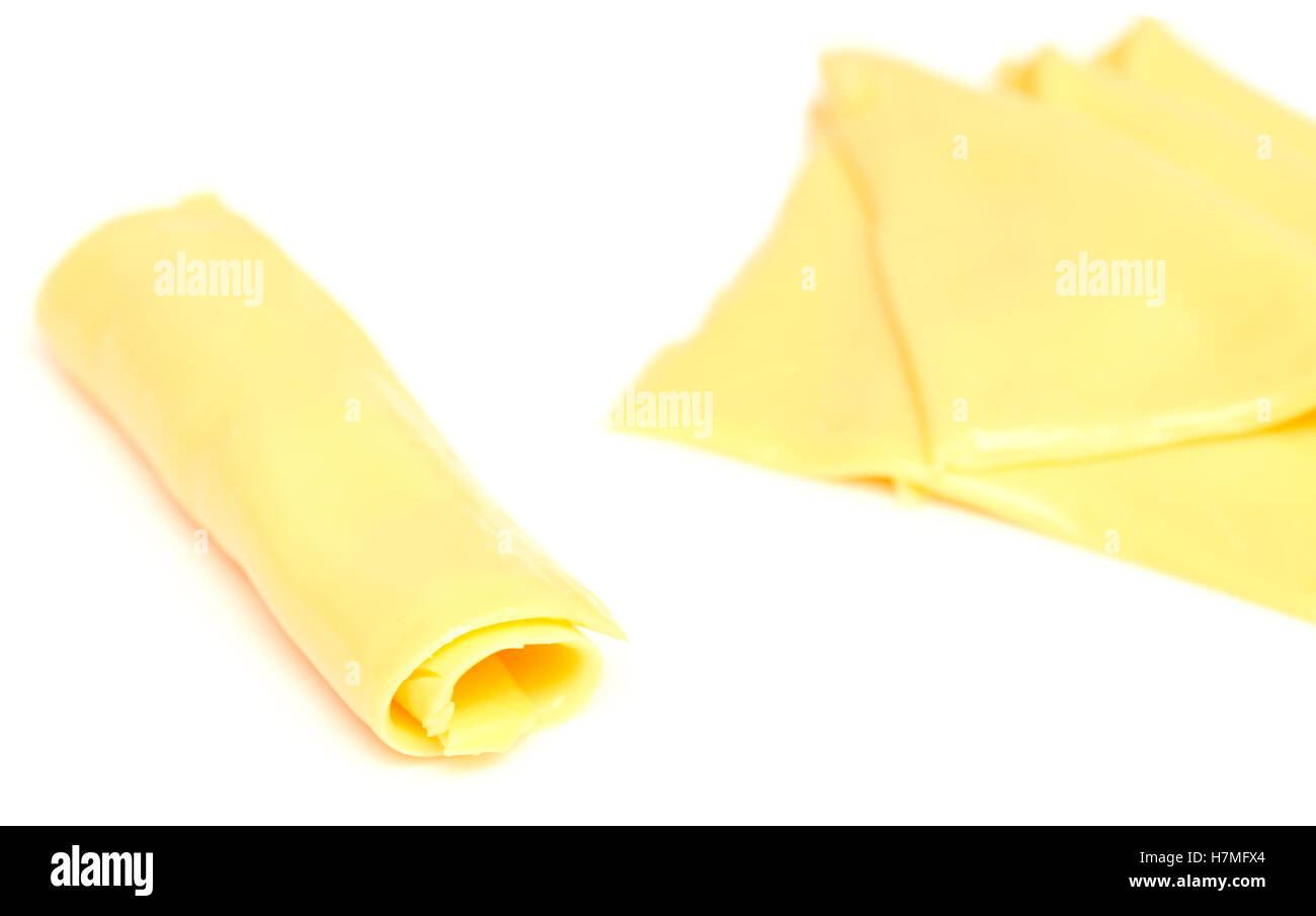 sliced cheese isolated on white background Stock Photo - Alamy