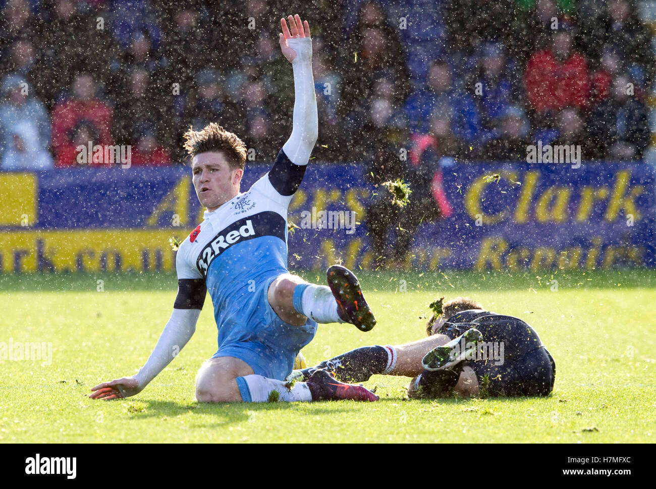 Rangers' Josh Windass challenges (left) Ross County's Ryan Dow during ...