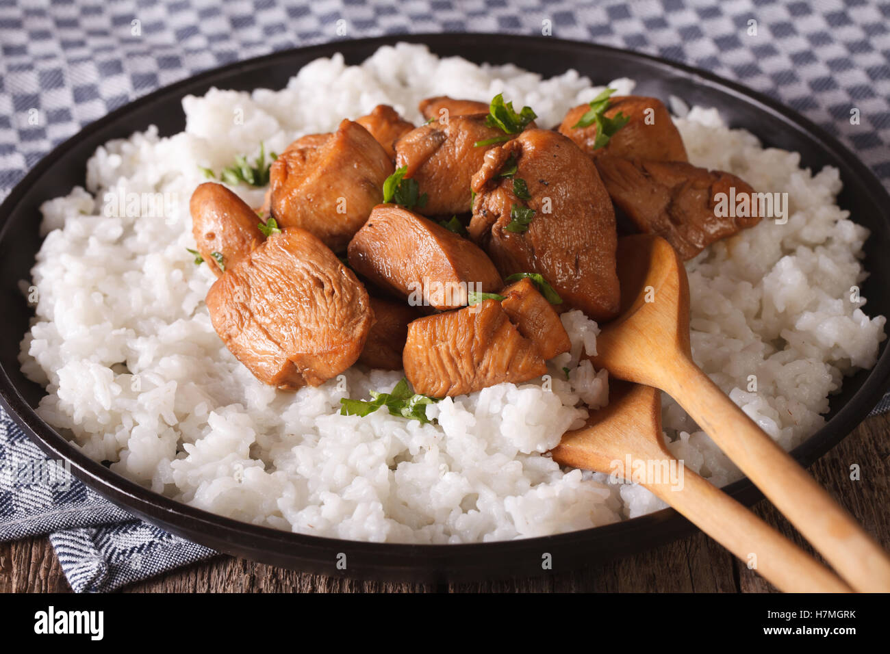 Philippine cuisine: Adobo with rice close-up on a plate. Horizontal ...
