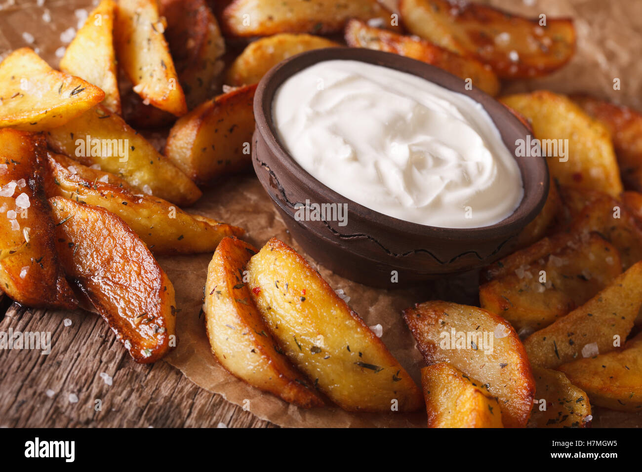 Fast food: Potato wedges and mayonnaise close-up on the table ...