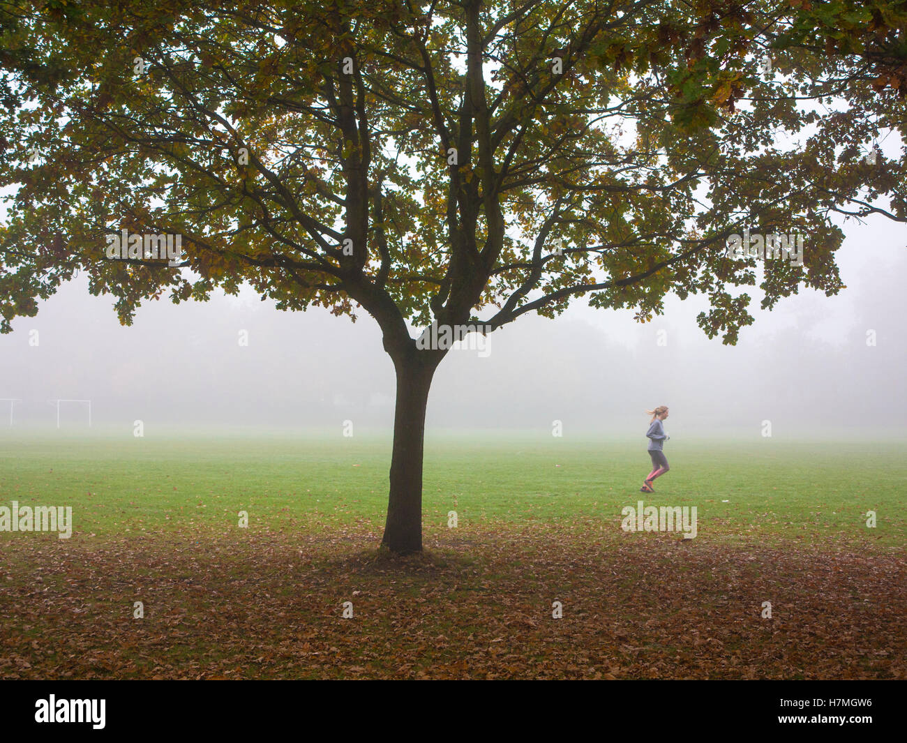 Woman jogging london mist hi-res stock photography and images - Alamy