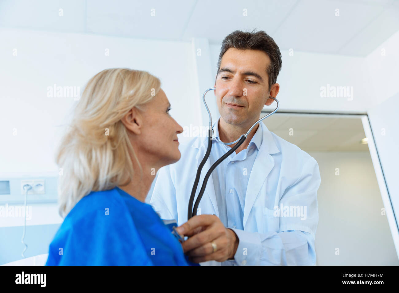 Doctor examining patient stethoscope mid hi-res stock photography and ...