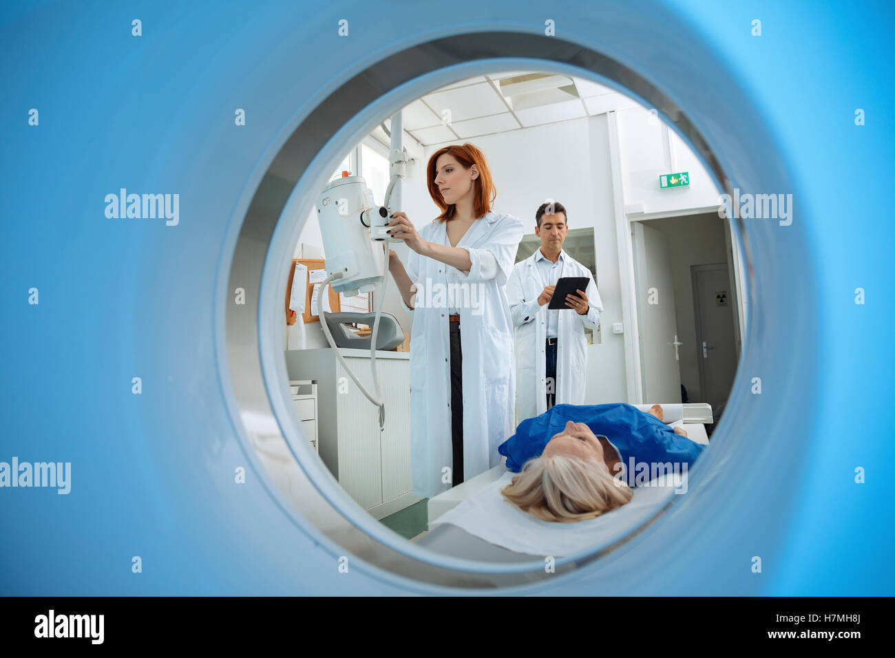 Radiologic technician and Patient being scanned and diagnosed on Stock ...