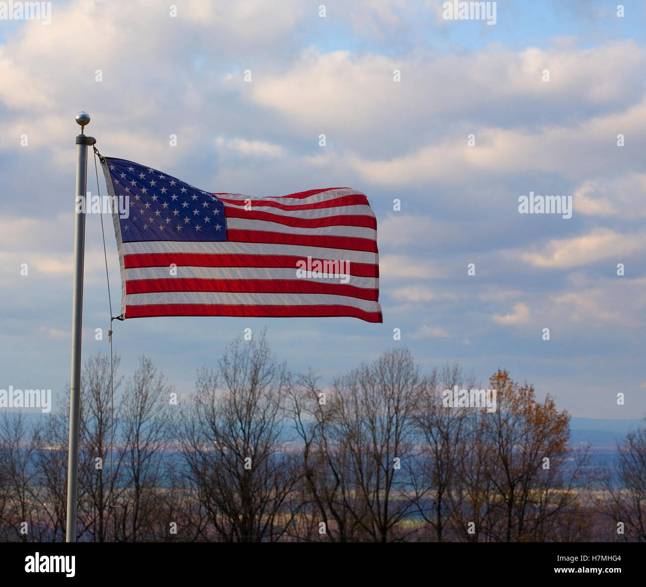 American flag waving in a breeze on the Blue Ridge over the Shenandoah ...