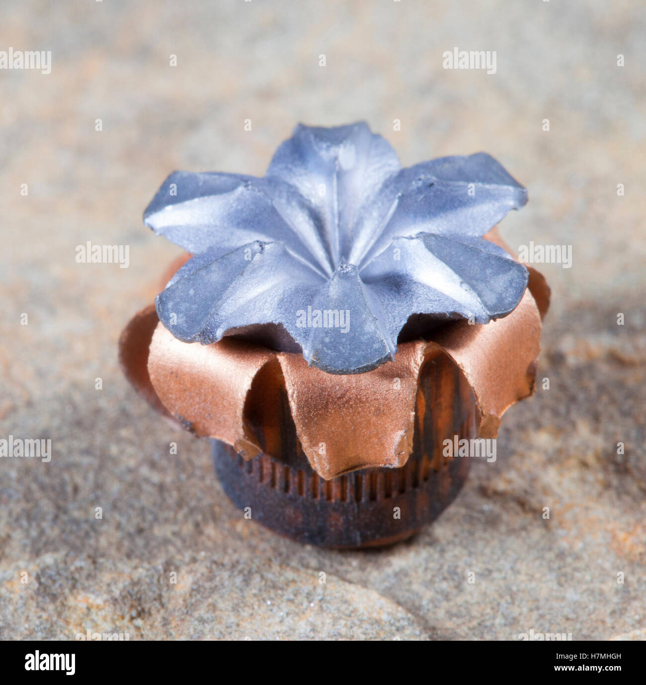 Hollow point bullet with a copper jacket expanded after testing Stock ...