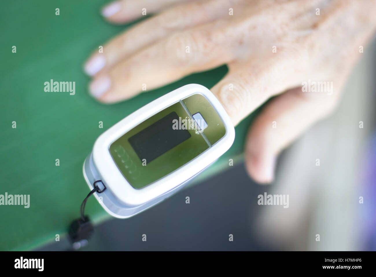 Portable hand held domestic cardiac finger pulse rate meter to show ...