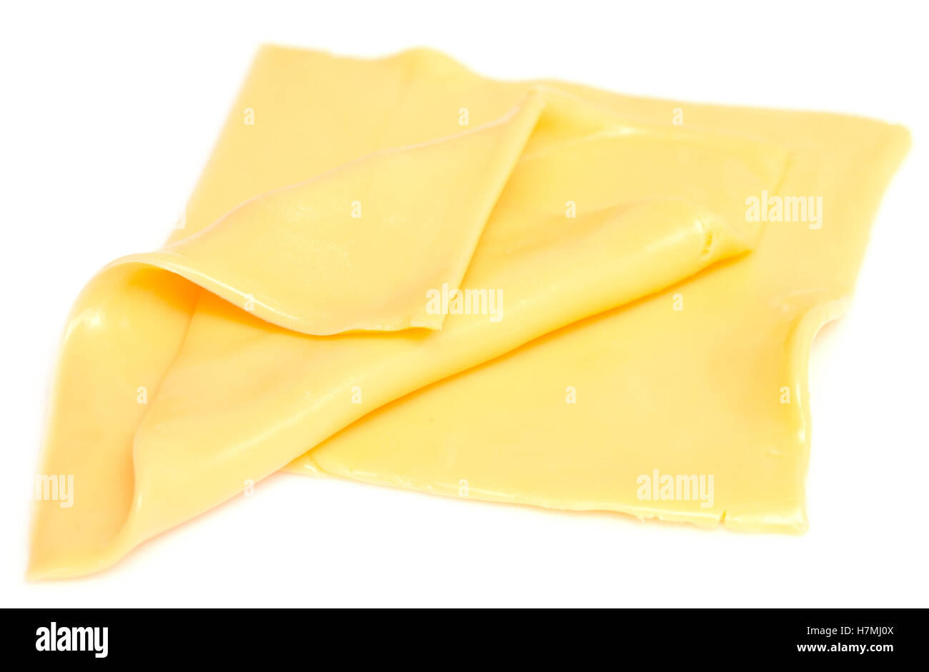 sliced cheese isolated on white background Stock Photo - Alamy