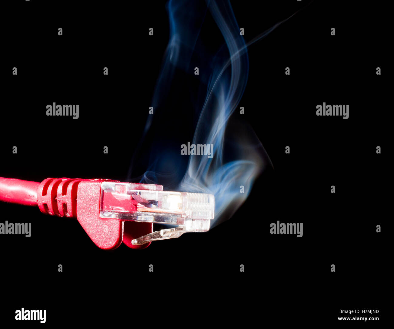 Computer network lan connection that is smoking with a black background ...