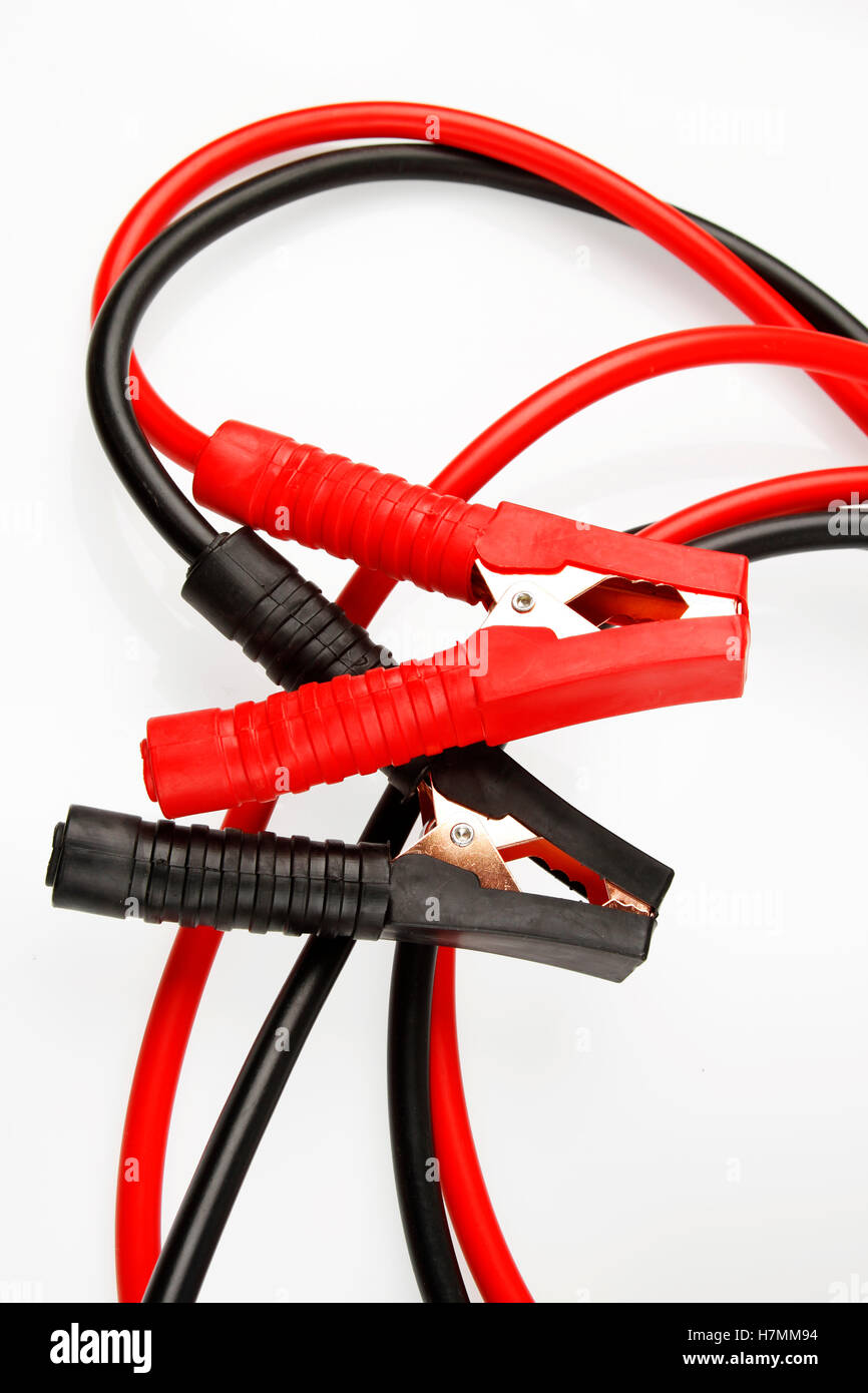 Jumper cables on plain background Stock Photo - Alamy