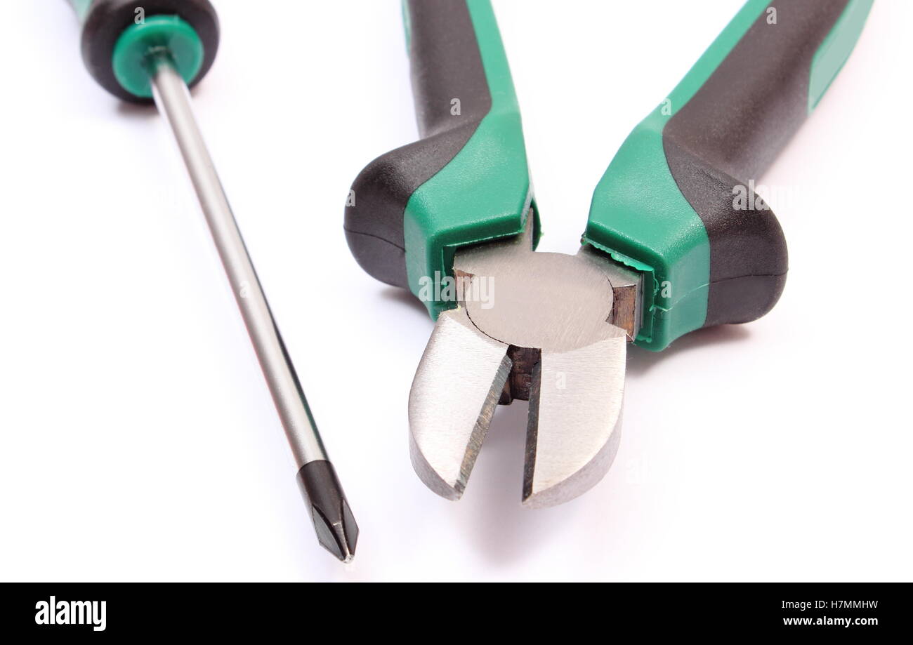 Electrical pliers and screwdriver isolated on white background, work ...