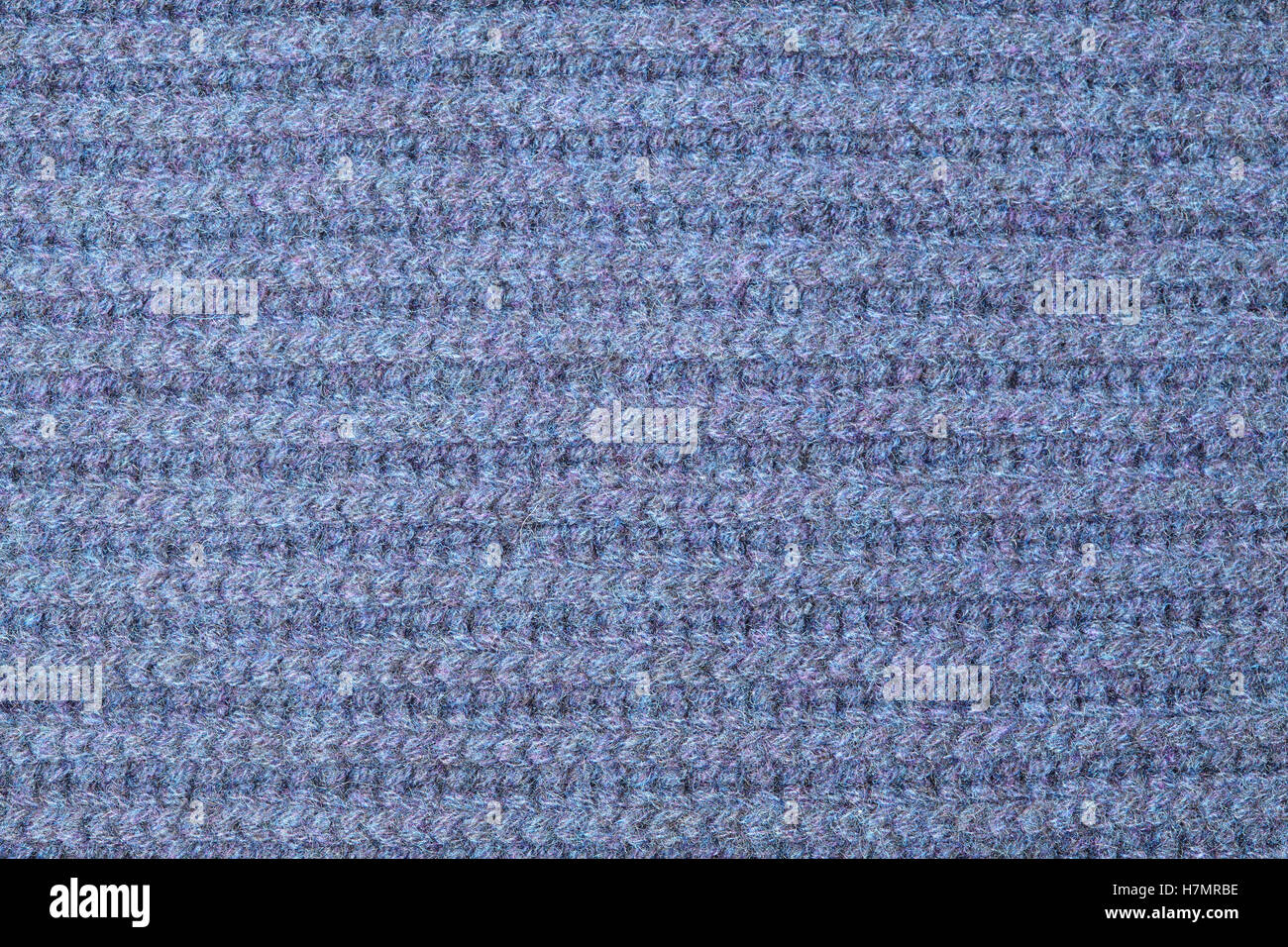 knit texture of blue wool knitted fabric with pattern as background ...