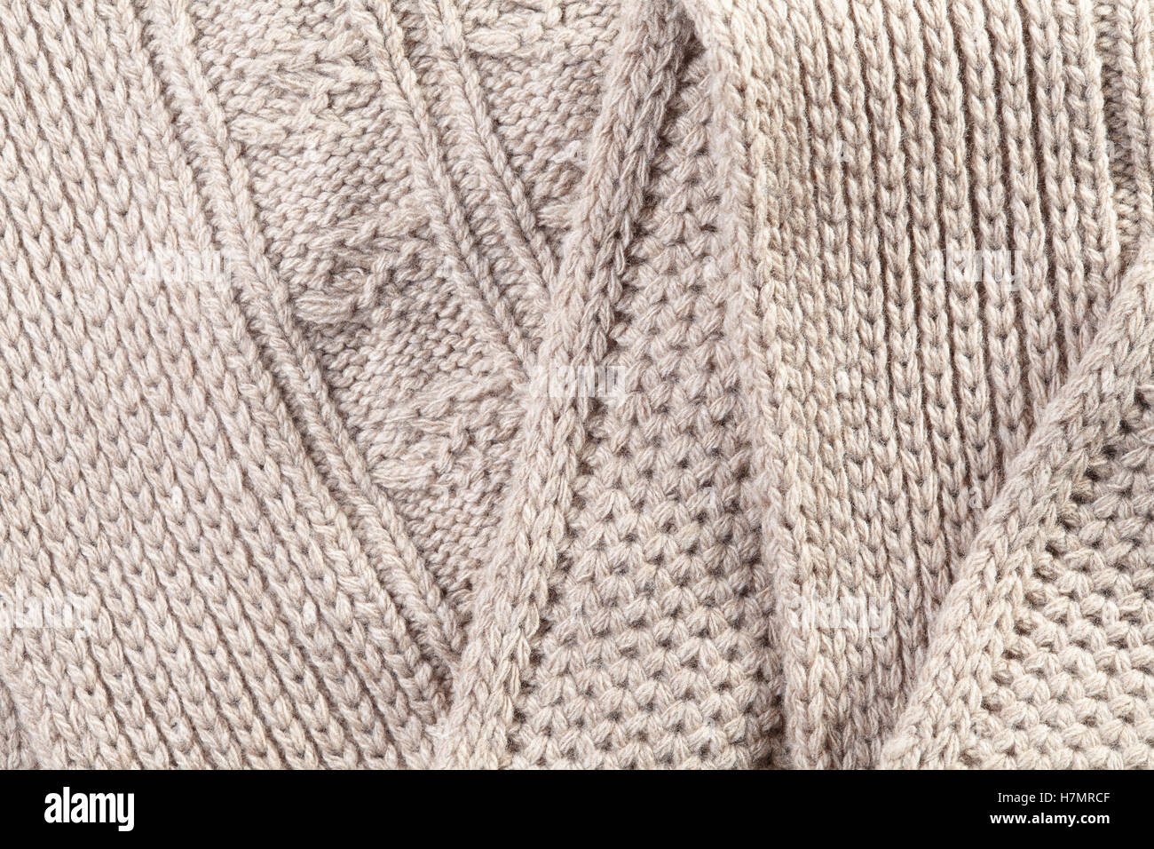 Handmade Beige knitted background and texture with folds Stock Photo ...