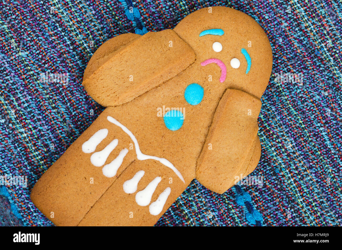 Gingerbread man on a table. Sad cookie Stock Photo - Alamy
