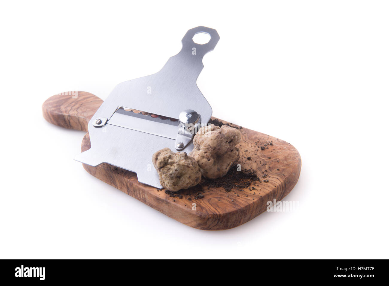 Alba white truffle tuber on wood board and truffle's knife Stock Photo ...