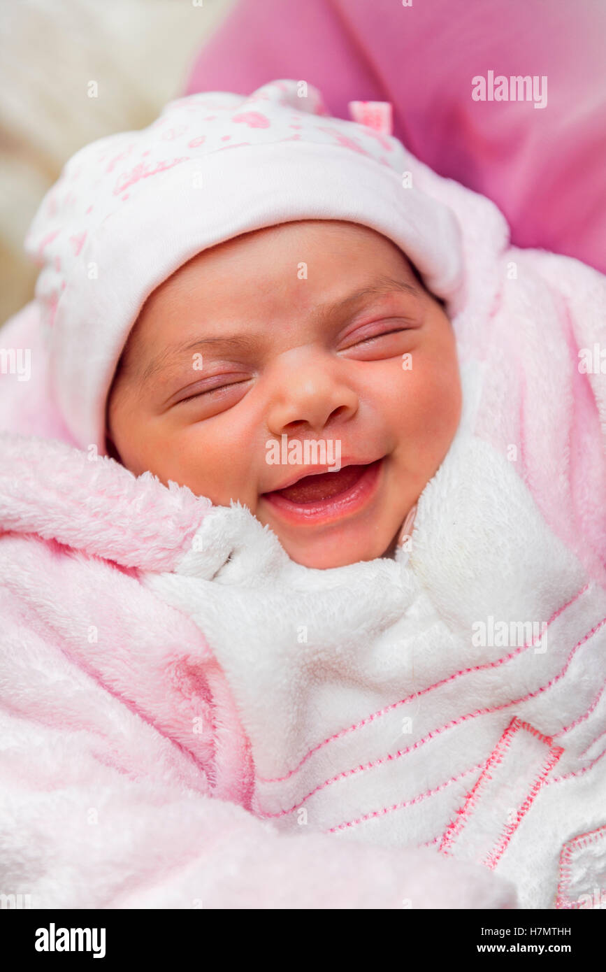 A Cute Smile of A Little Sleeping Newborn Baby Stock Photo - Alamy