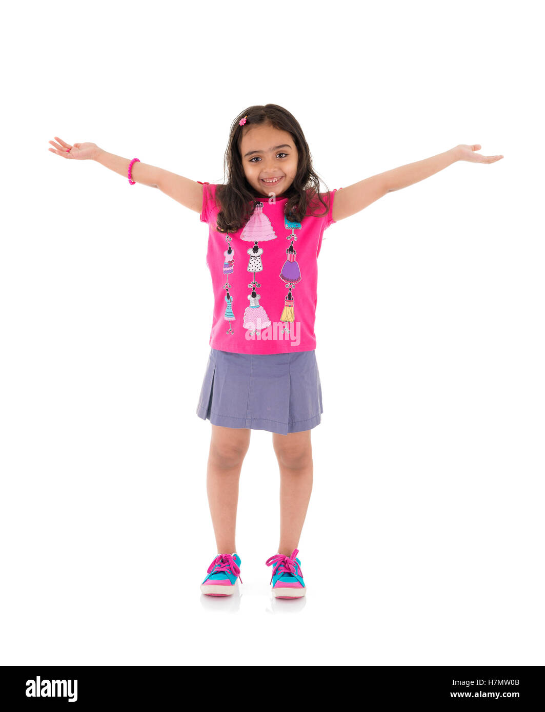 A Happy Little Girl Putting Her Arms Up In The Air Isolated on White ...
