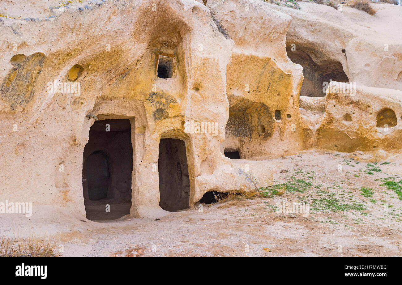 The openings to the chambers in the ancient Uchisar Castle in rock ...