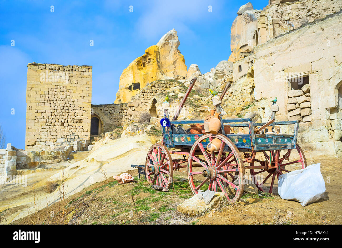 The old wooden wagon hanging with the clay jars is advertising of the ...