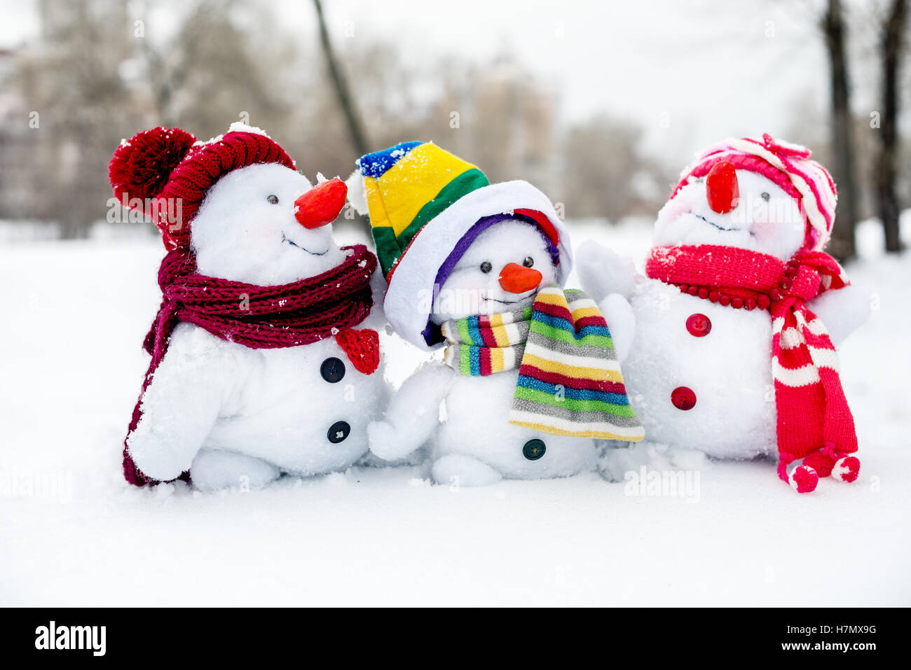 Happy snowman family Stock Photo - Alamy