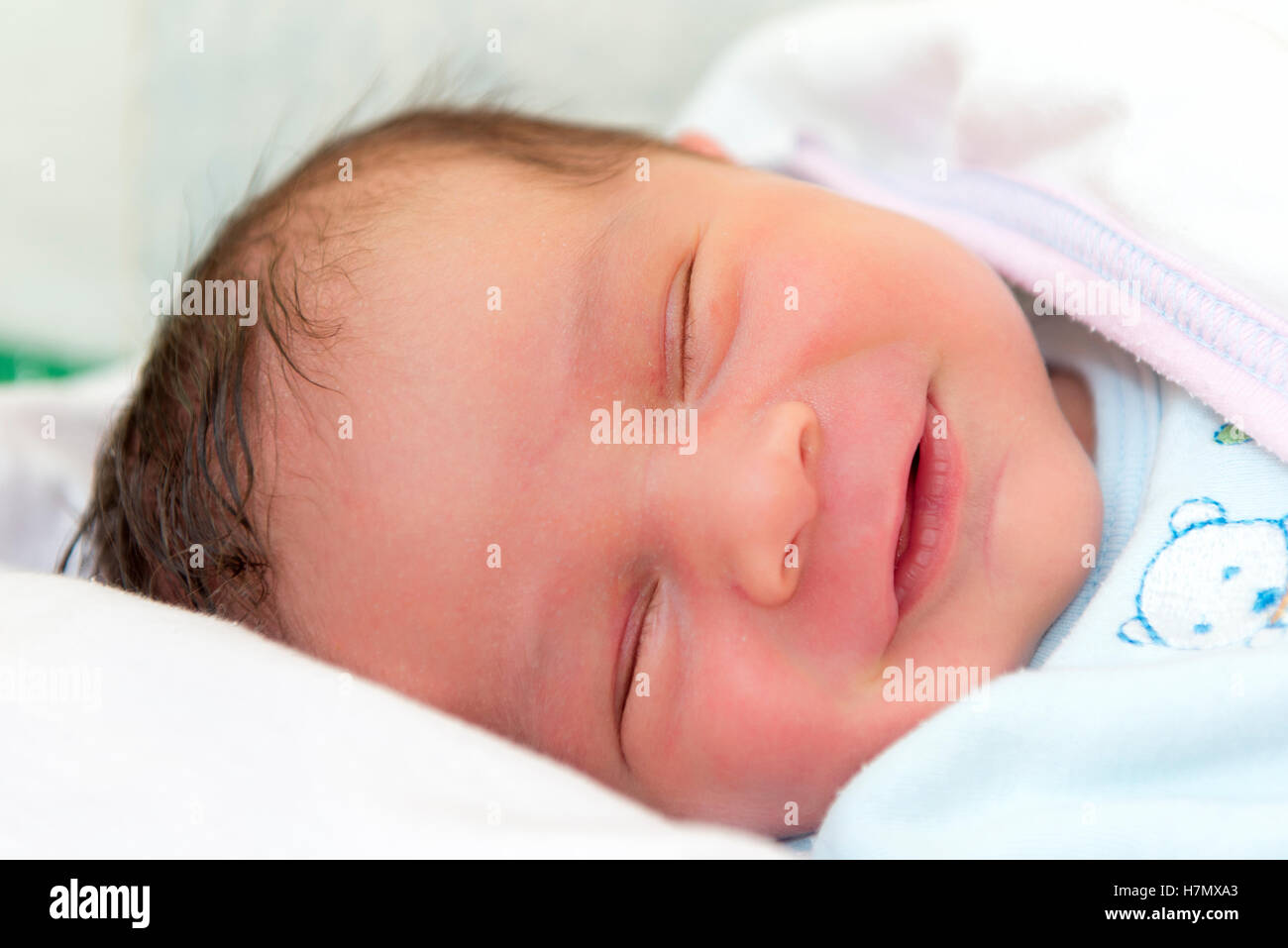 A Baby Boy with Smily Face During Sleep Stock Photo - Alamy