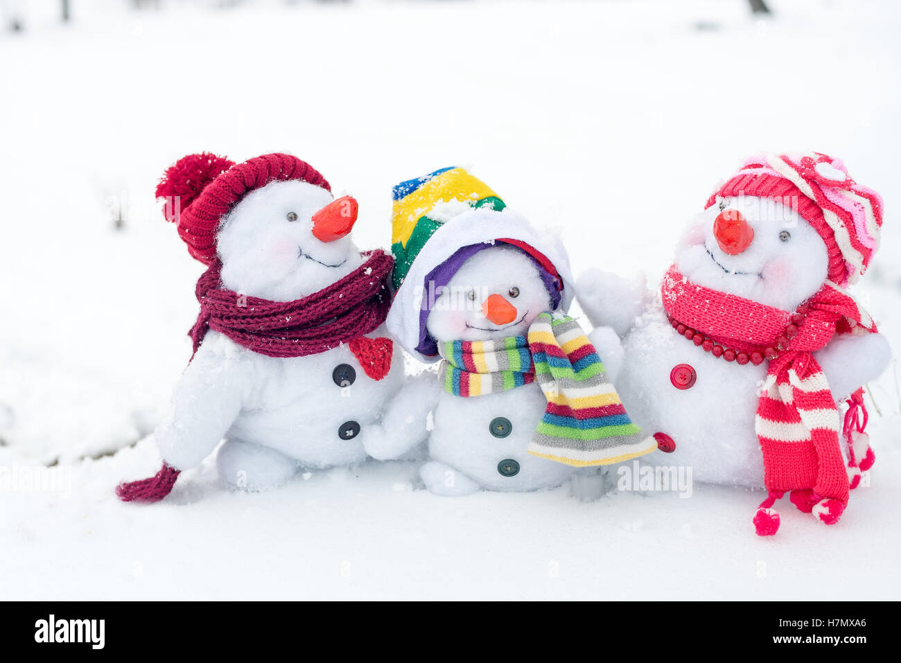 Happy snowman family Stock Photo - Alamy
