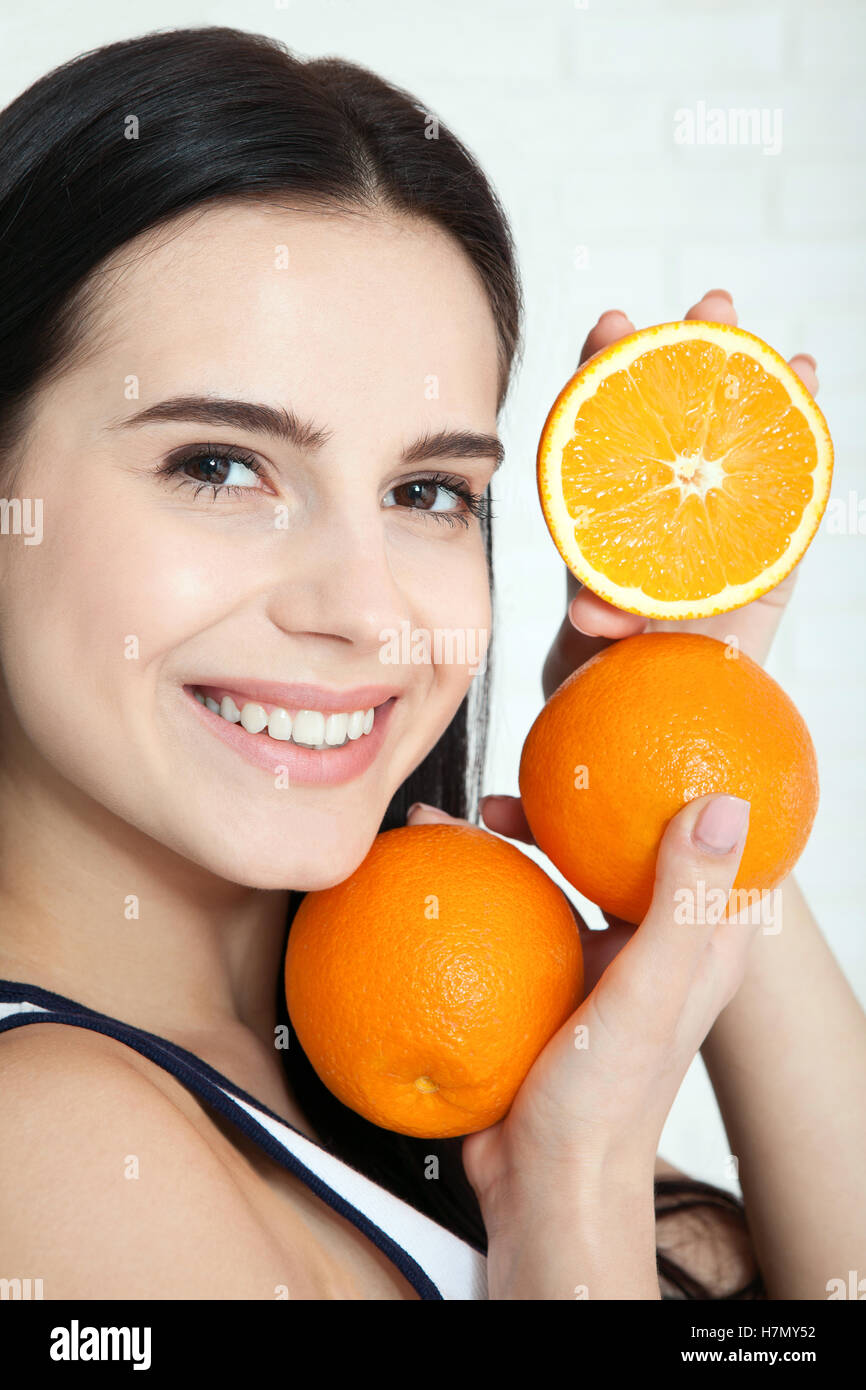 Woman with orange close-up face. Beautiful women exists to clean skin ...