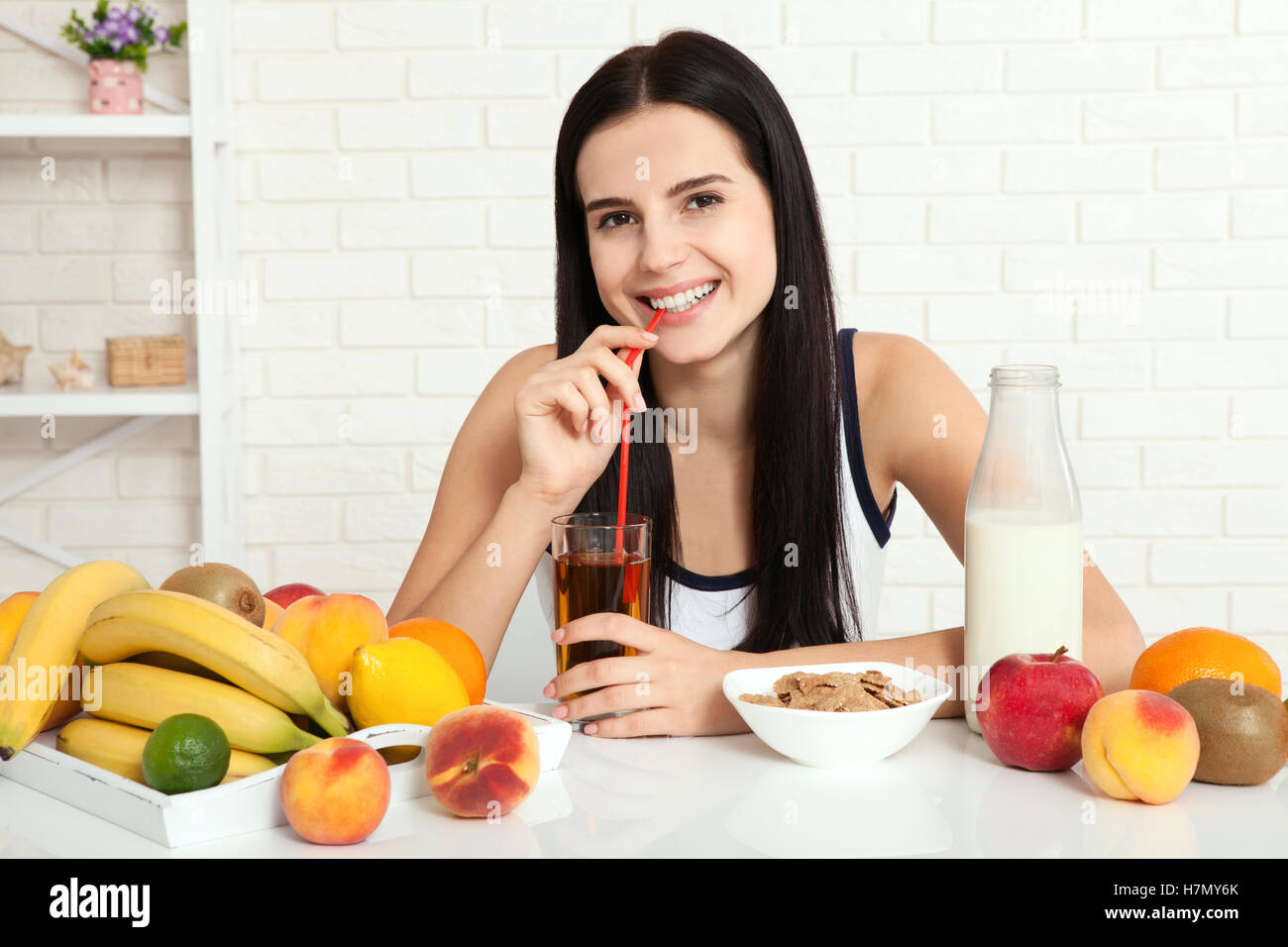 Beautiful women exists with pure skin on her face sitting at a table ...
