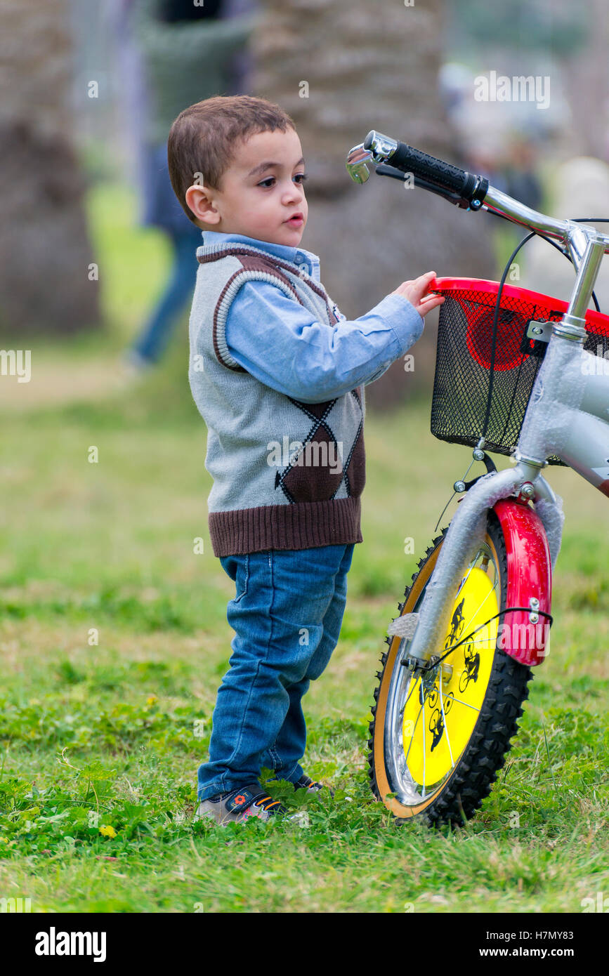 A Young Little Boy Standing with His Bike Outdoor Stock Photo - Alamy